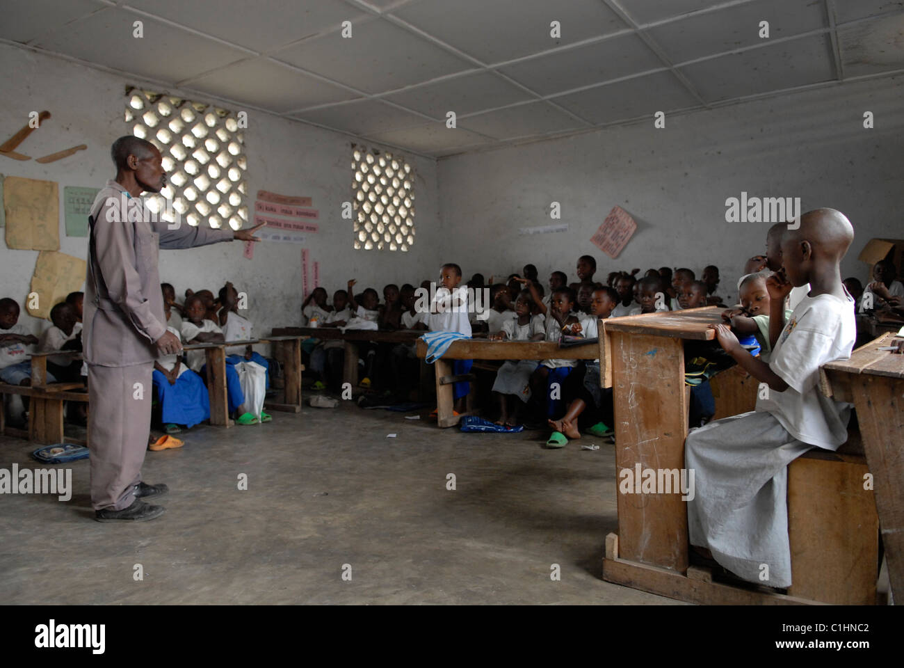 Teacher explaining lesson to pupils in a primary classroom in North ...