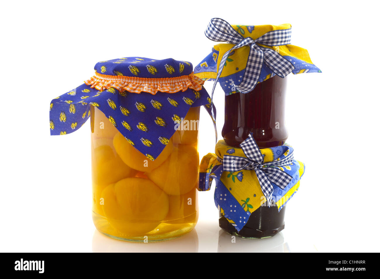 Preserved fruit in glass pots on white background Stock Photo - Alamy