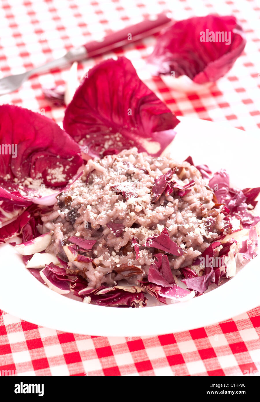 Rice with red chicory in a plate, a popular dish in North Italy Stock ...