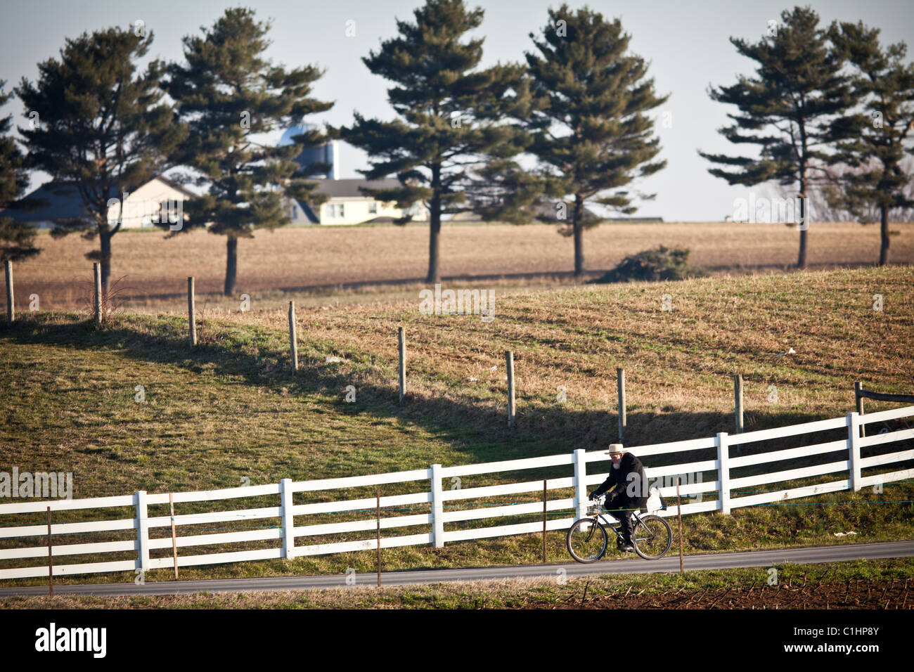 Amish riding bike bicycle hi-res stock photography and images - Alamy
