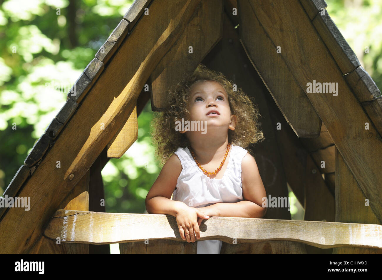 Girl standing in tree house Stock Photo - Alamy