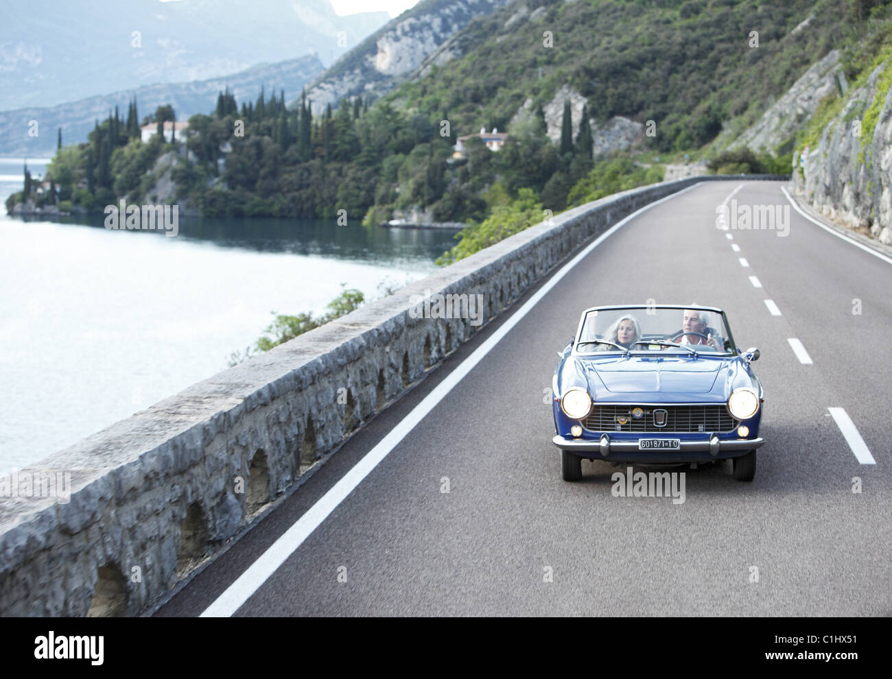 Woman driving convertible highway hi-res stock photography and images ...