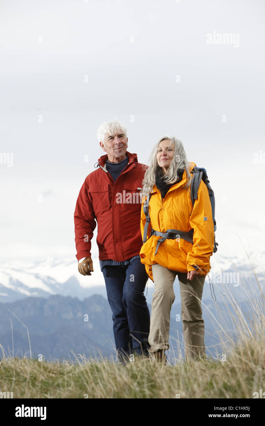 Senior couple hiking in mountain range, Italy Stock Photo - Alamy