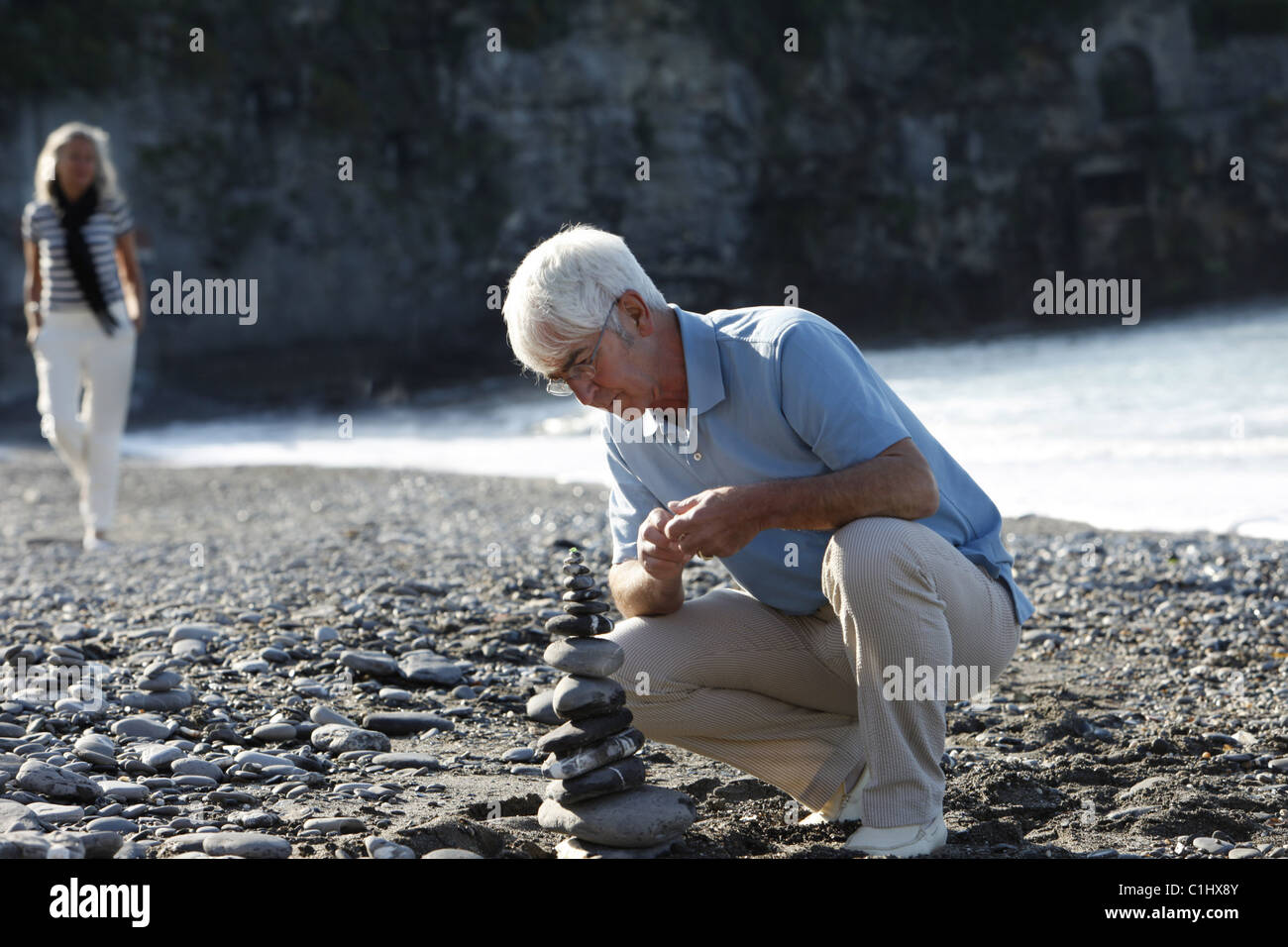 Man stacking stones hi-res stock photography and images - Alamy
