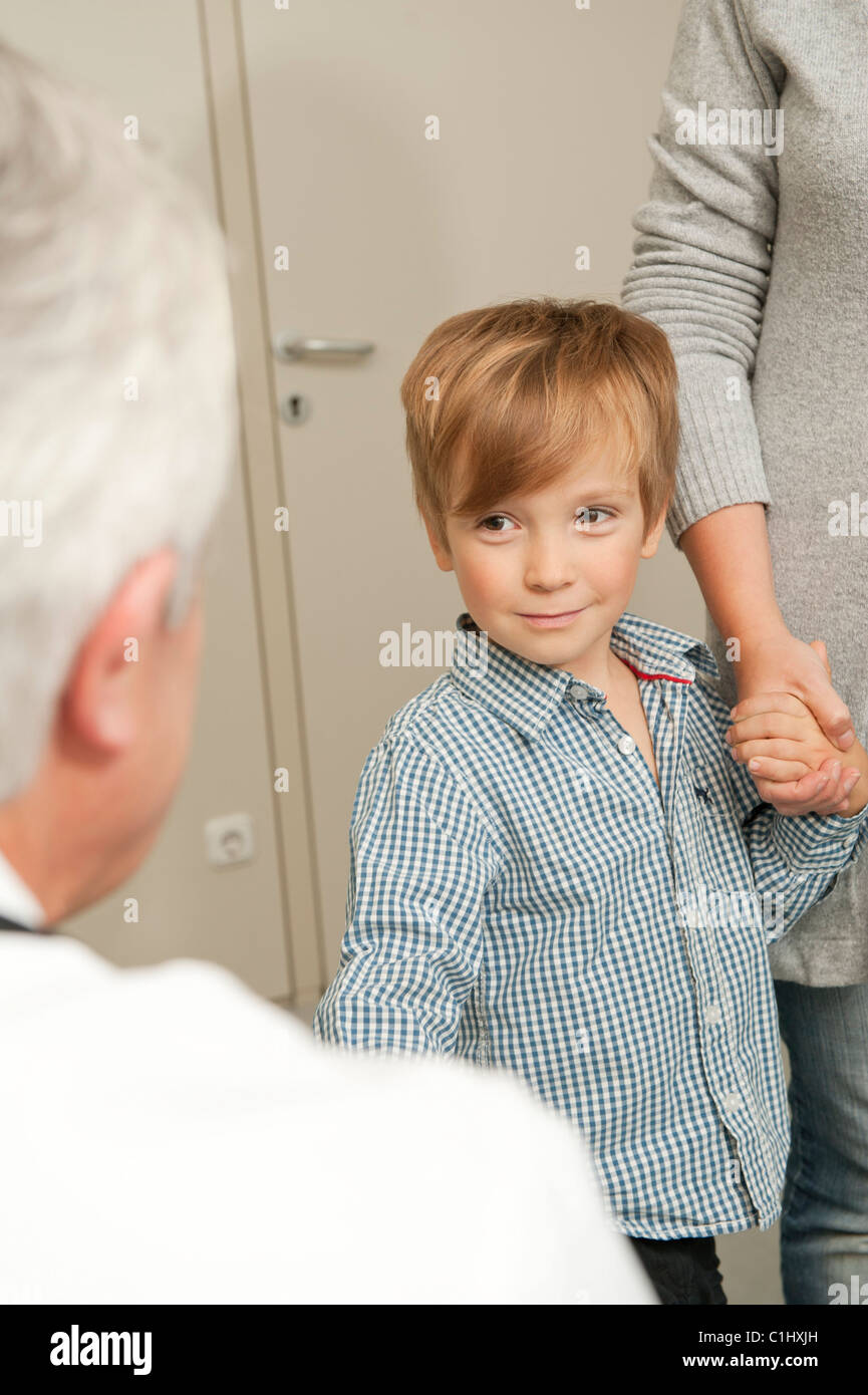 Pediatric senior doctor examining hi-res stock photography and images ...