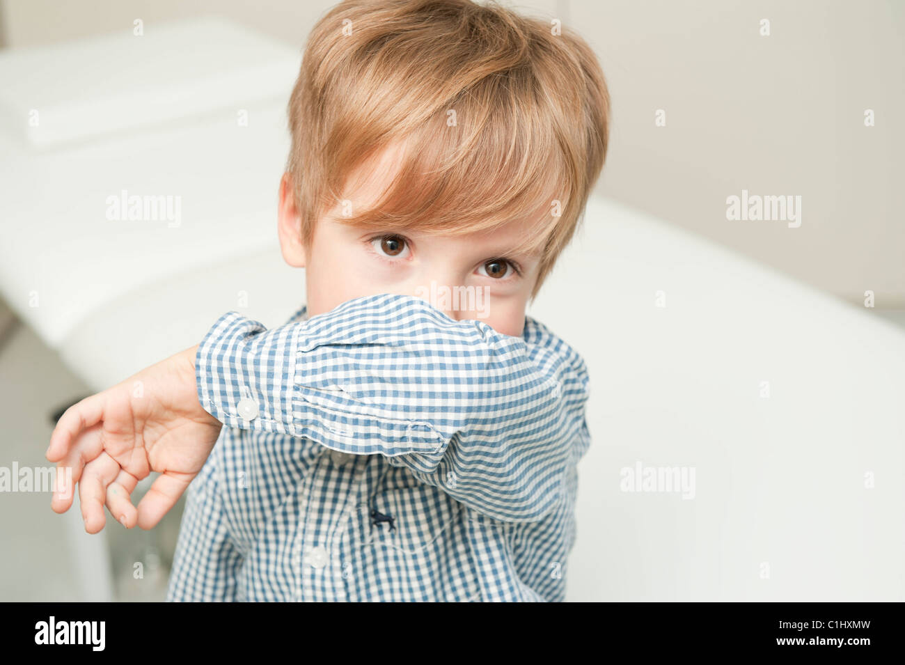 Boy cough in medical practice Stock Photo - Alamy