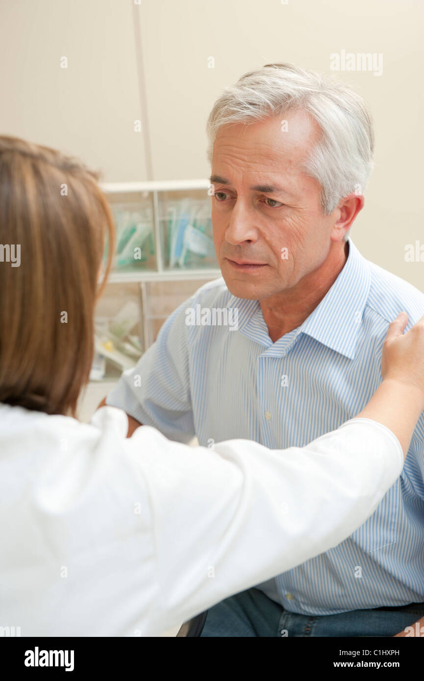 Female doctor comforting patient Stock Photo - Alamy