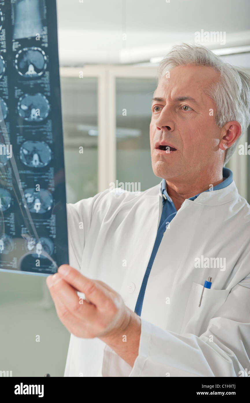 Doctor looking at x-ray Stock Photo - Alamy