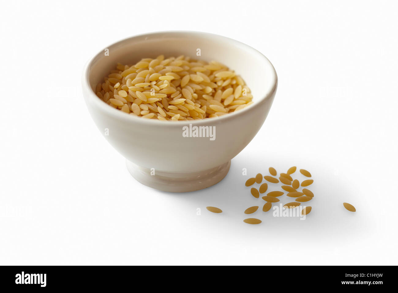 Uncooked orzo pasta Cut Out Stock Images & Pictures - Alamy