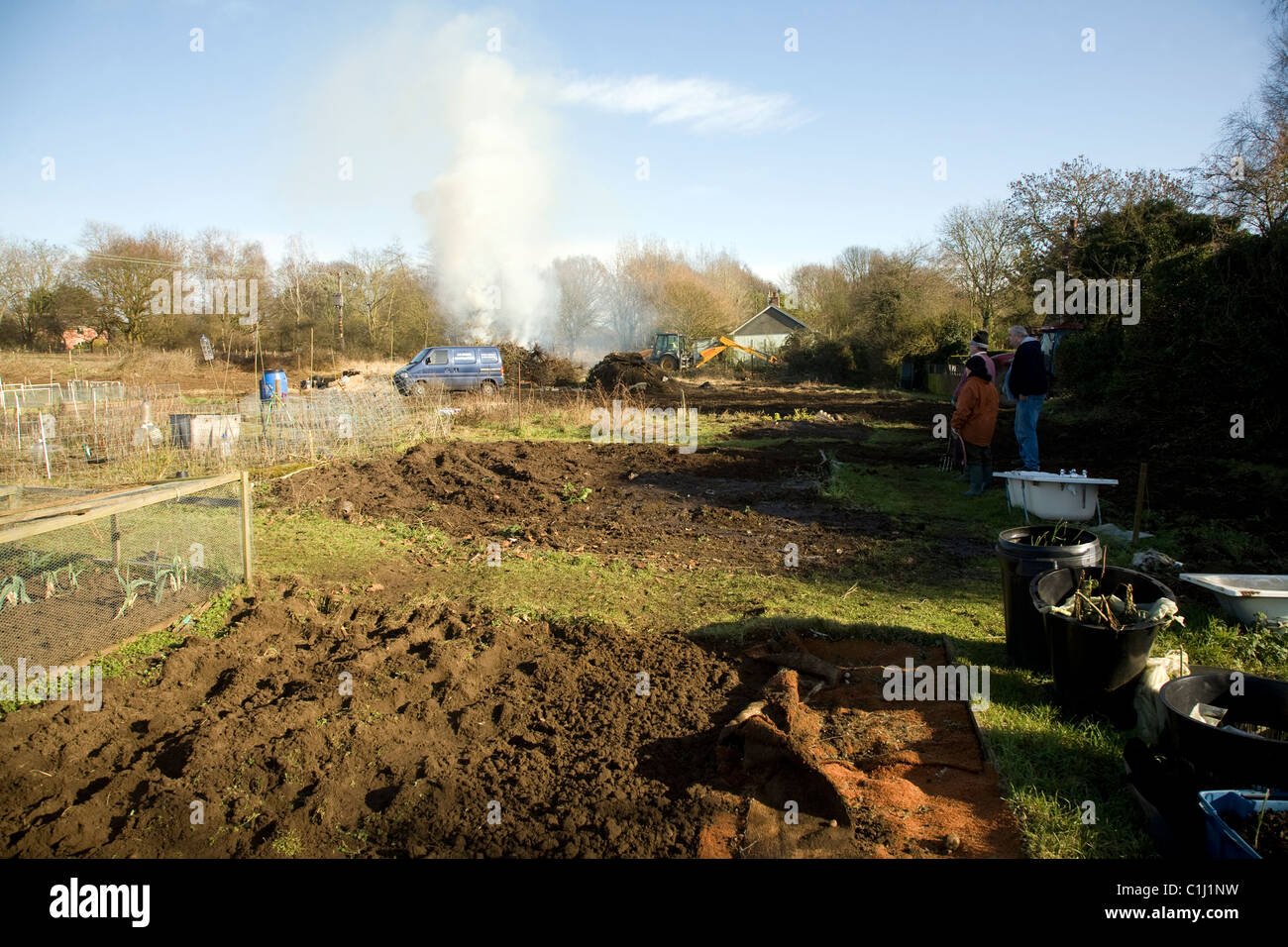 Contractor clearing land for new allotment bonfire Stock Photo - Alamy