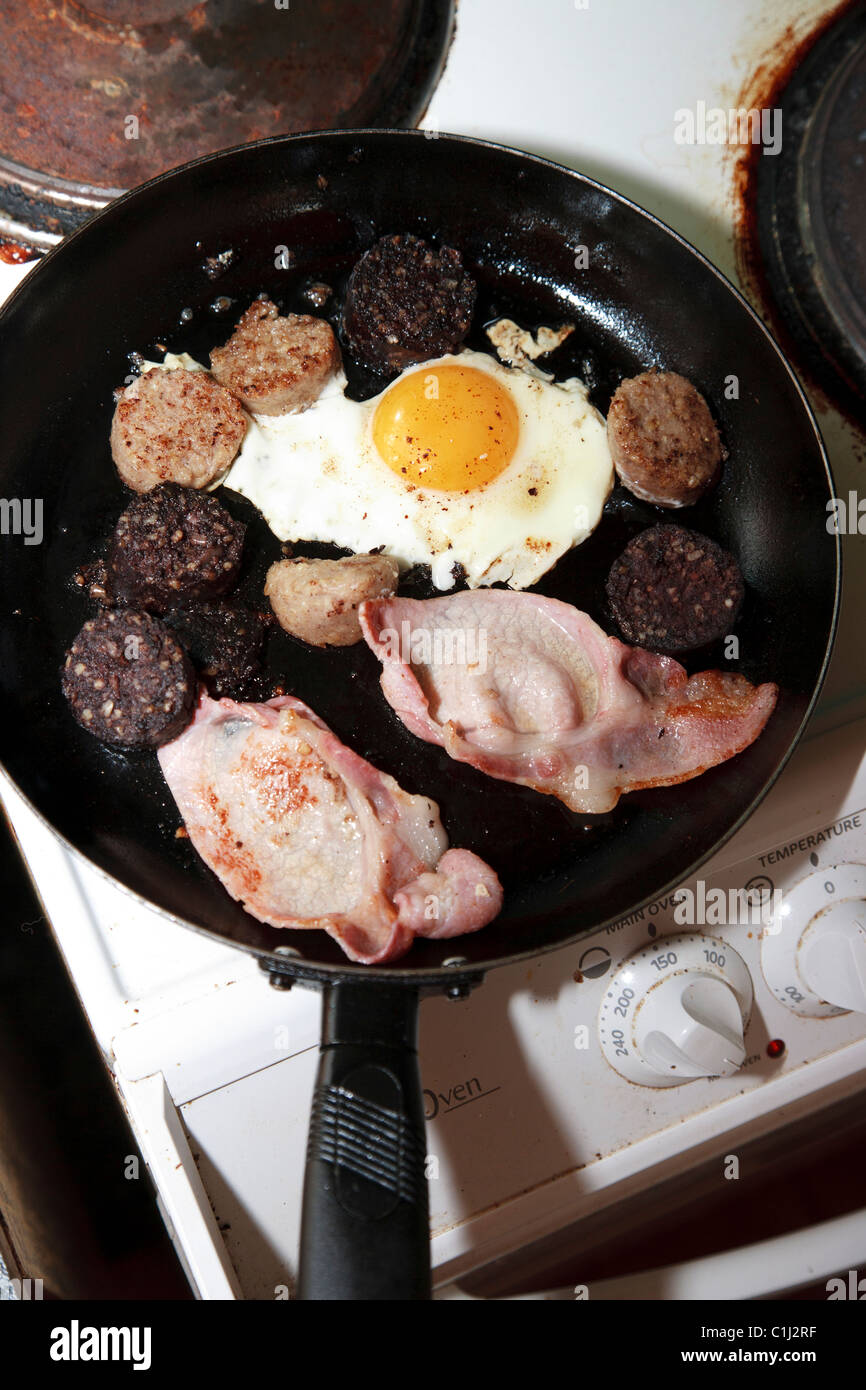 Frying pan with with fried food Stock Photo - Alamy