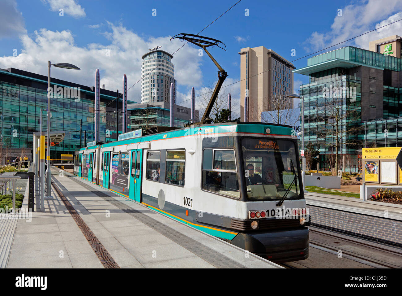 Metro tram at the Salford Quays terminus of Manchester Metrolink next ...