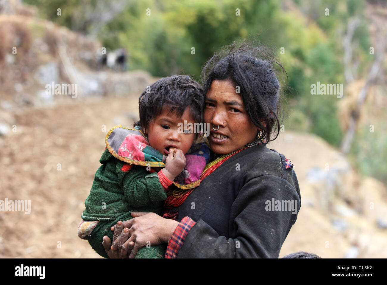 Nepali mother with child Stock Photo - Alamy