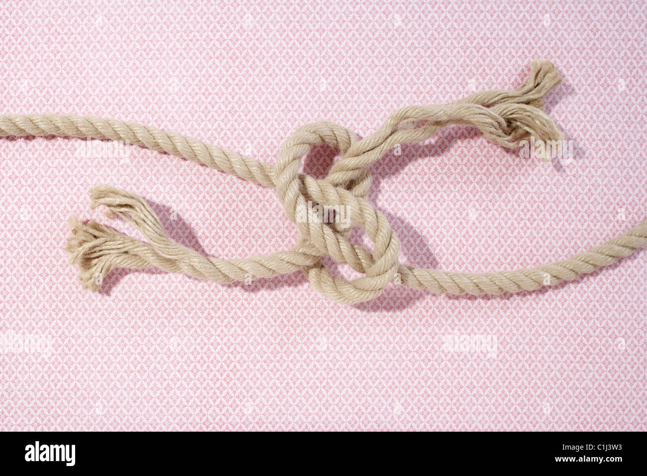 Ropes Tied in Knot Stock Photo - Alamy