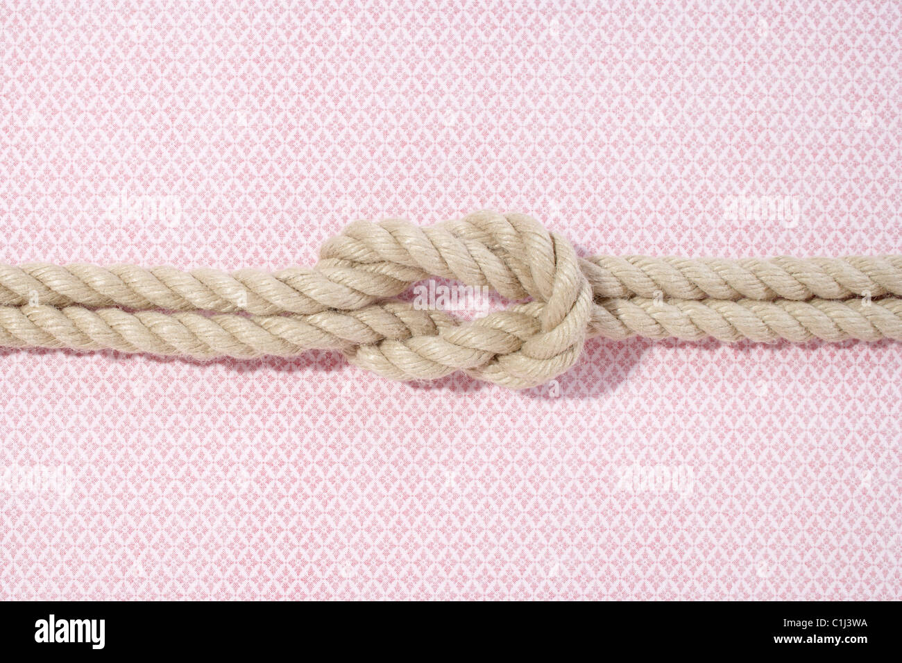 Ropes Tied in Knot Stock Photo - Alamy