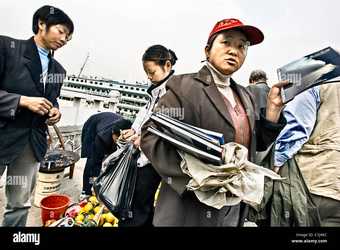 CHINA, SANDOUPING: Vendors aggressively selling souvenirs and books ...