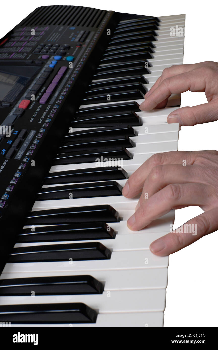 Male hands playing piano keyboard Stock Photo - Alamy