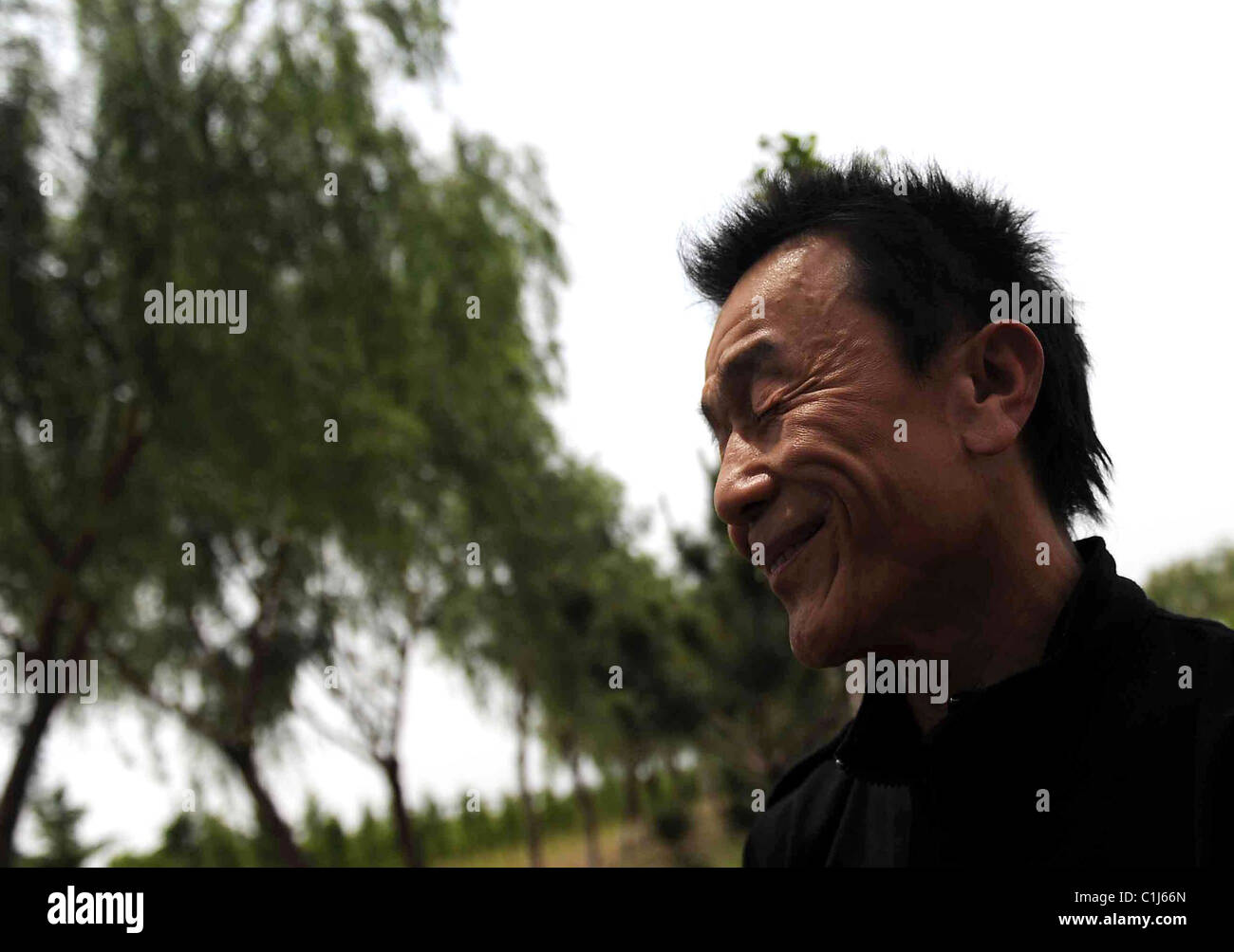 AGE-OLD QUESTION... With crow's feet, distinguished wrinkled cheeks ...