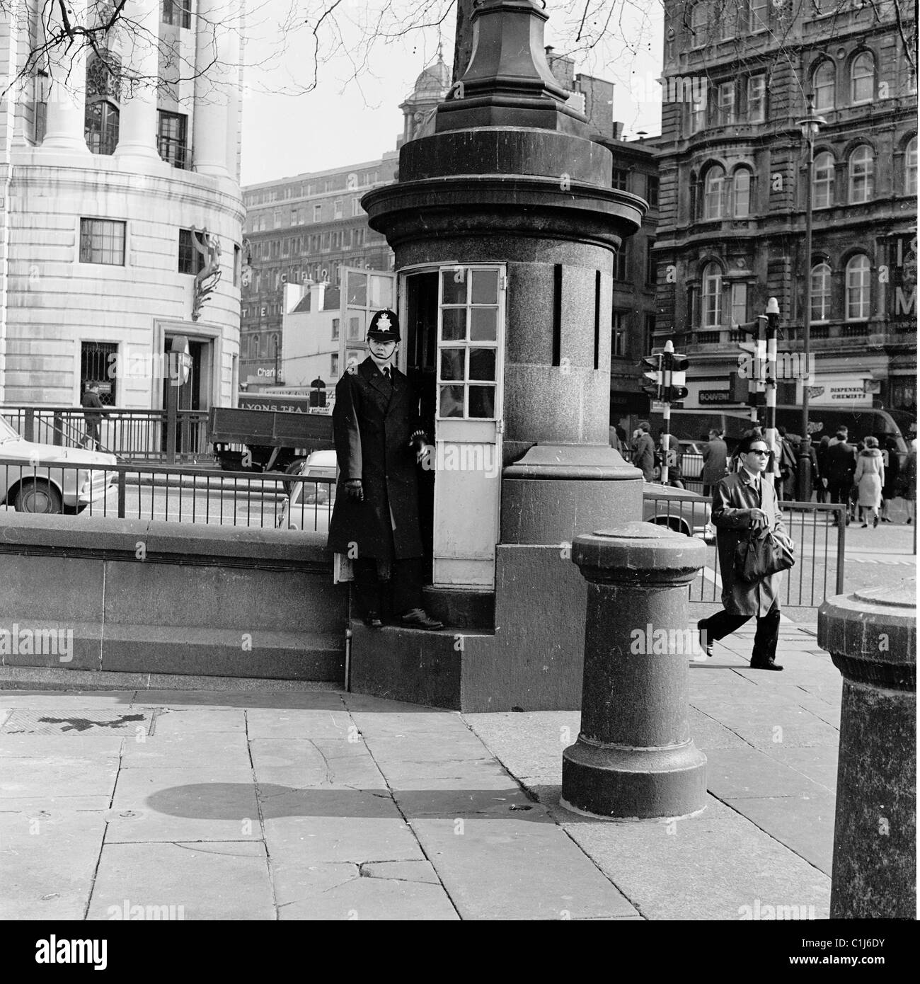 1960s, a British police constable standing at the one-man police box at ...