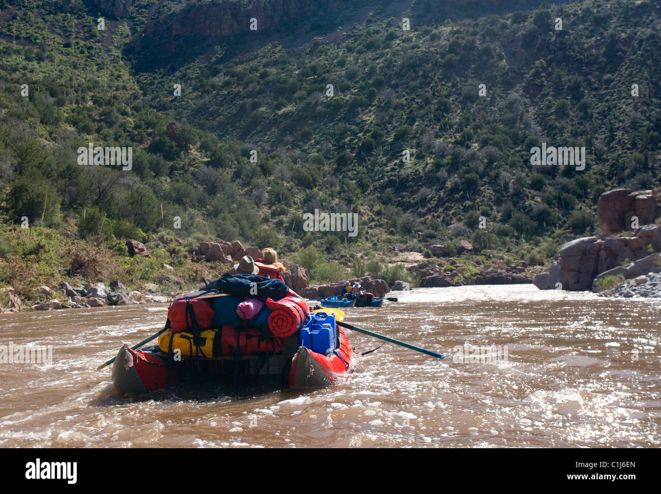 2 couples rafting on the Salt River in Arizona, USA on inflatable ...
