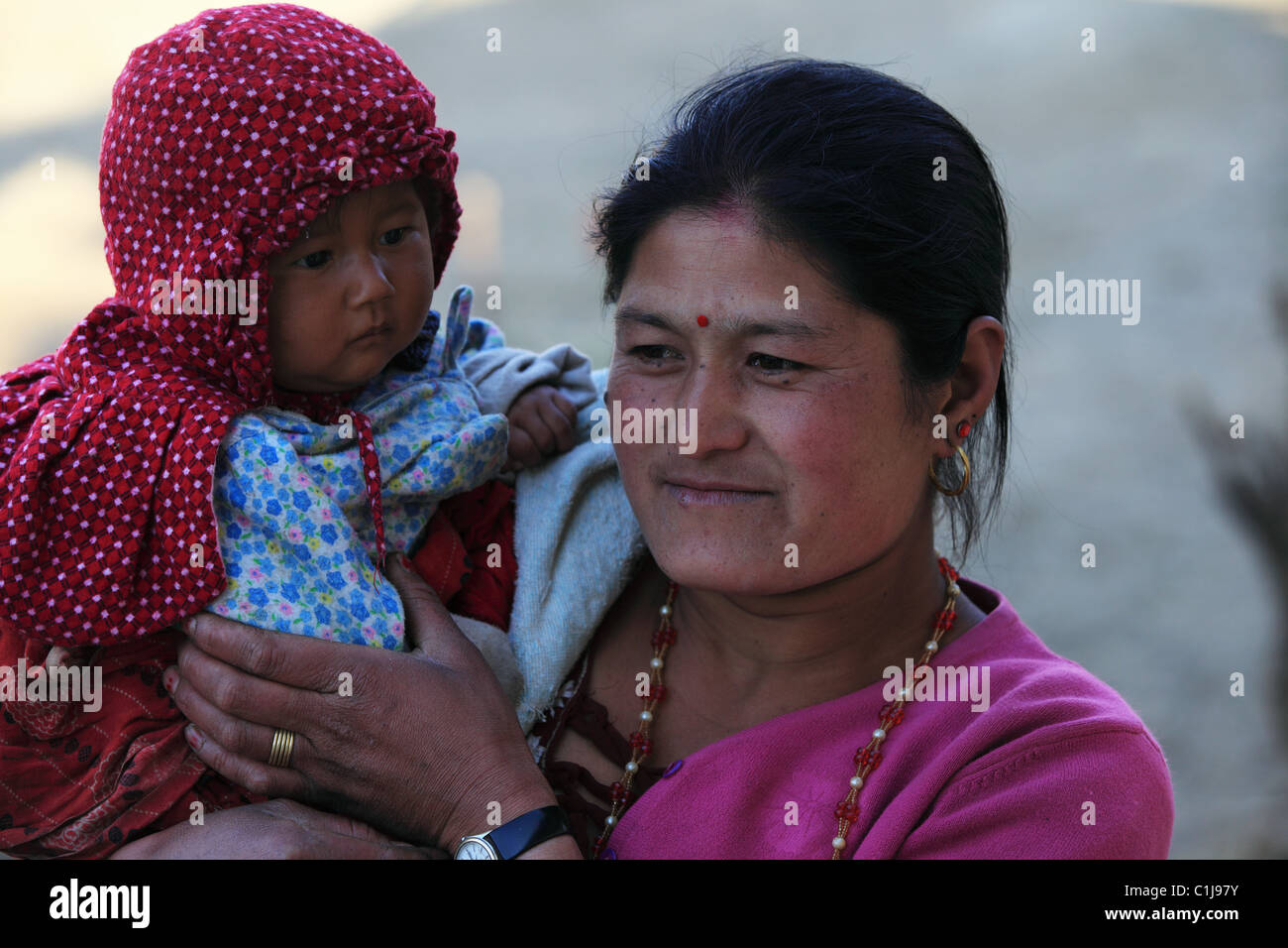 Nepali mother with child Stock Photo - Alamy