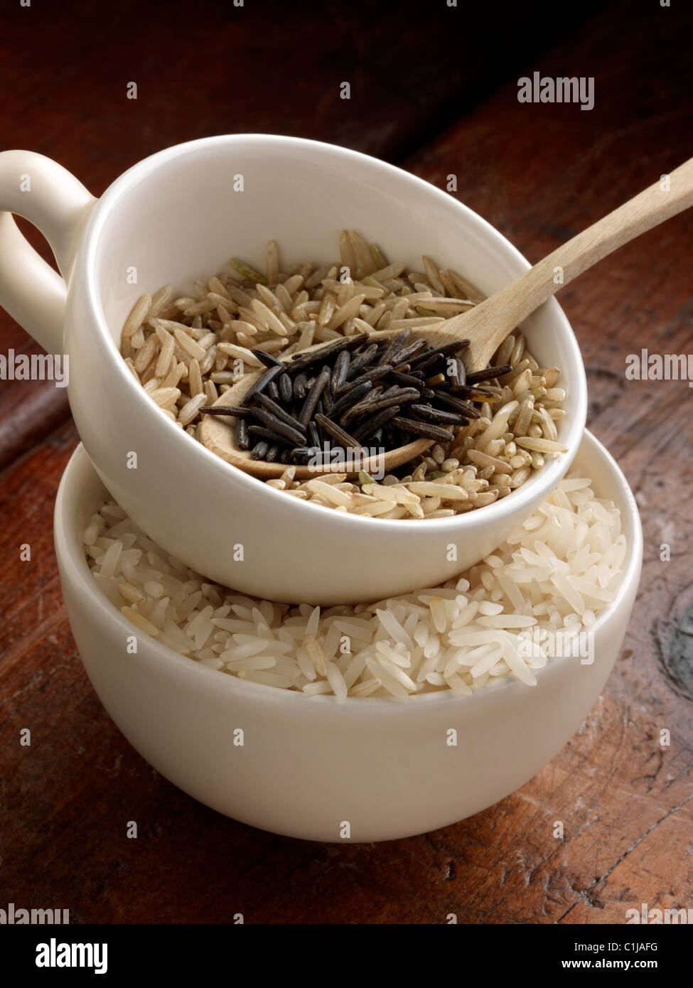 Wild rice brown and Basmati in measuring cups Stock Photo - Alamy