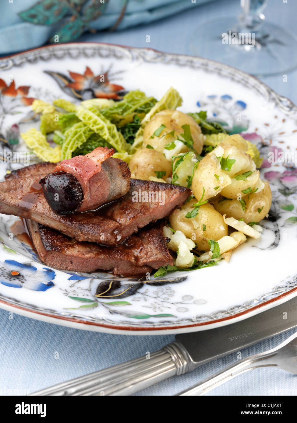 Calves liver with devils on horseback cabbage and potatoes Stock Photo ...
