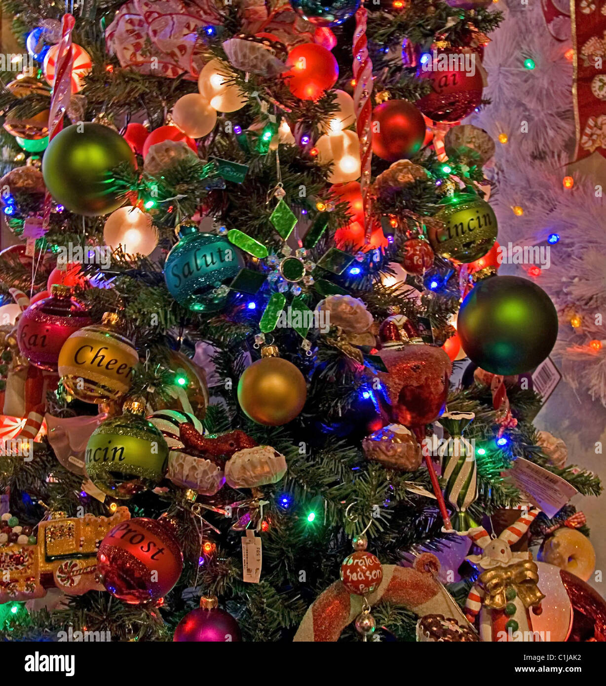 This Christmas tree is decorated heavily with many different colored ...