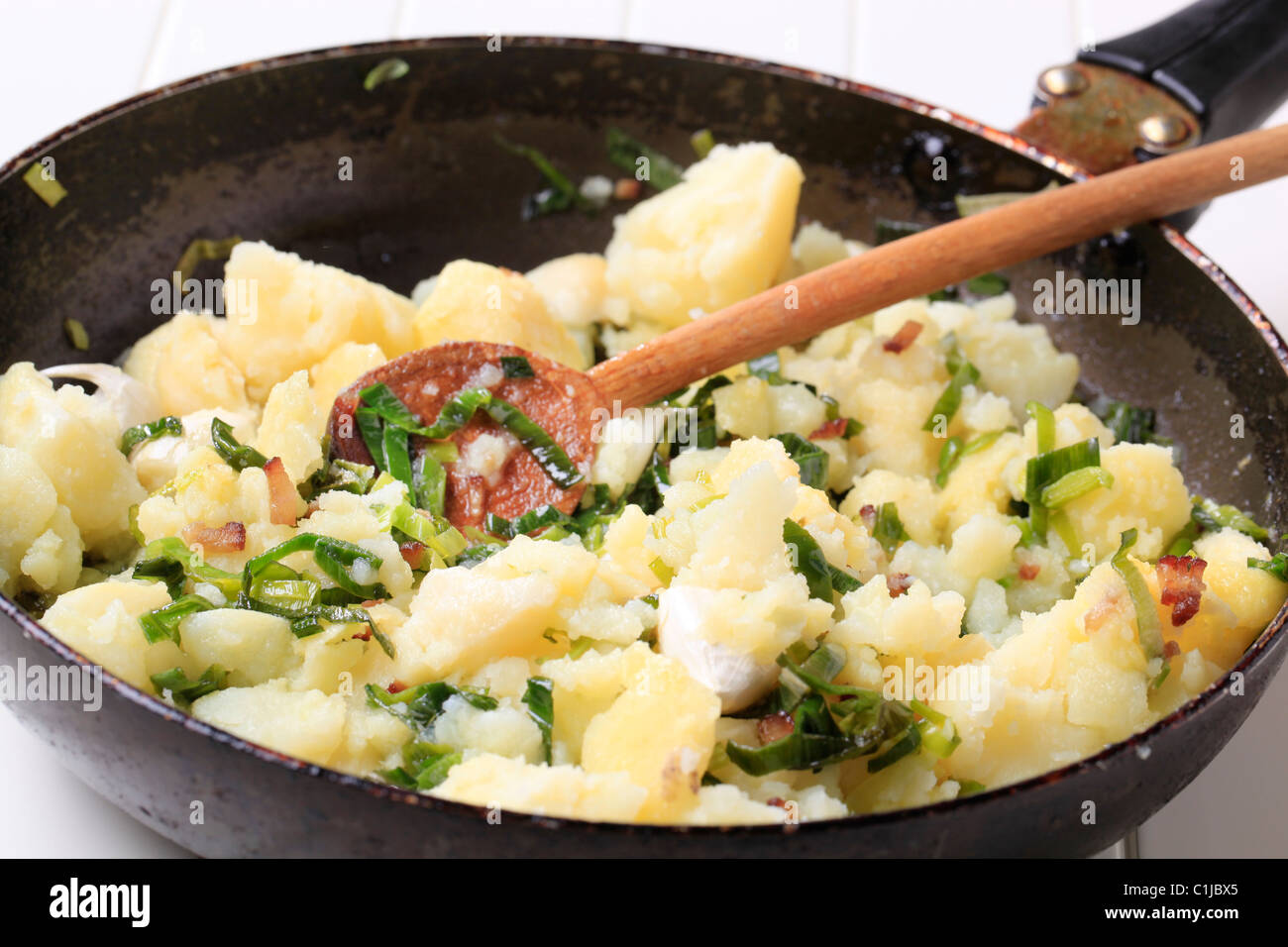 Crushed potatoes stir fried with spring onion and garlic Stock Photo ...
