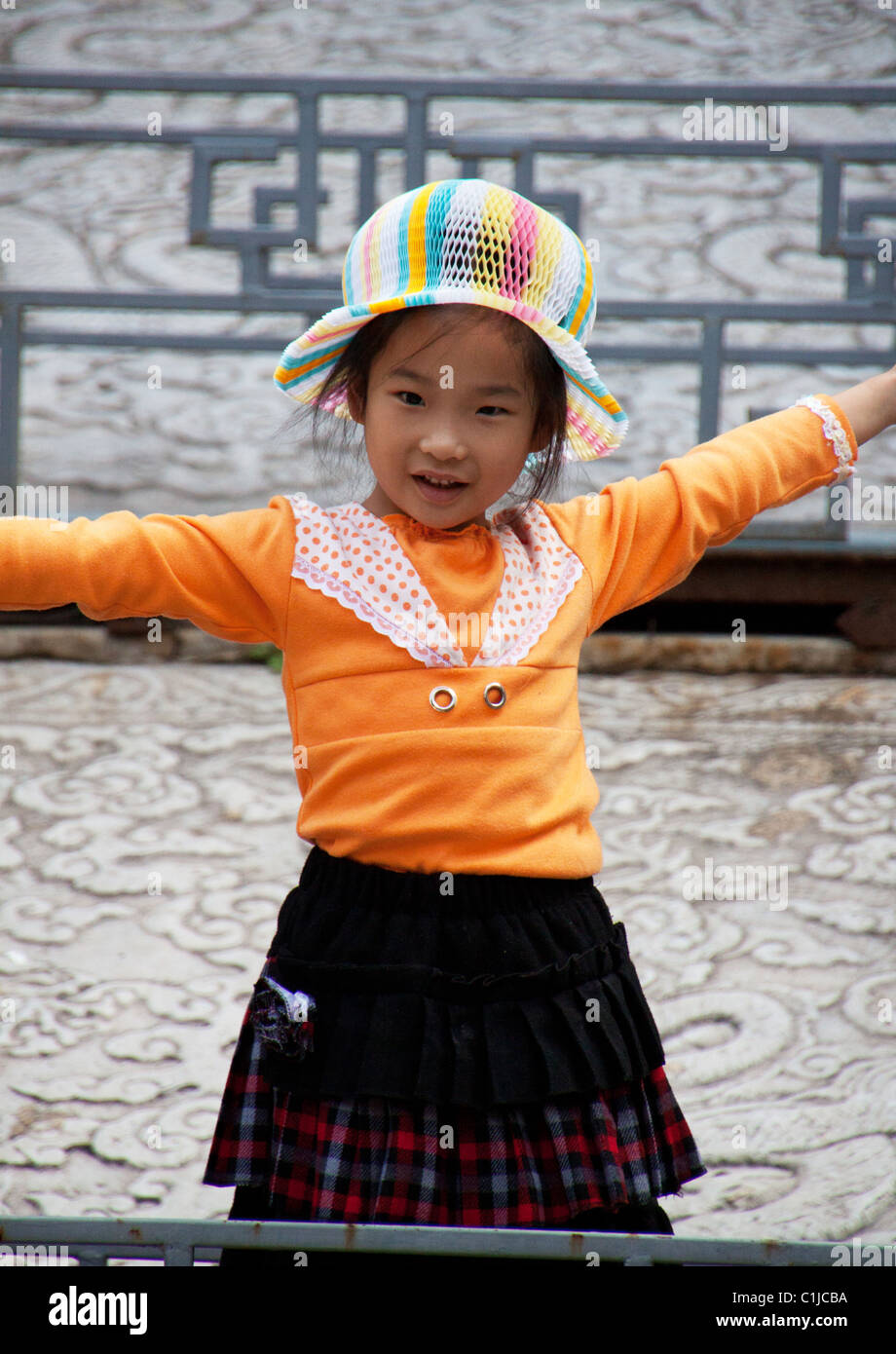 Happy Chinese little girl poses at the Great Wall of China Stock Photo ...