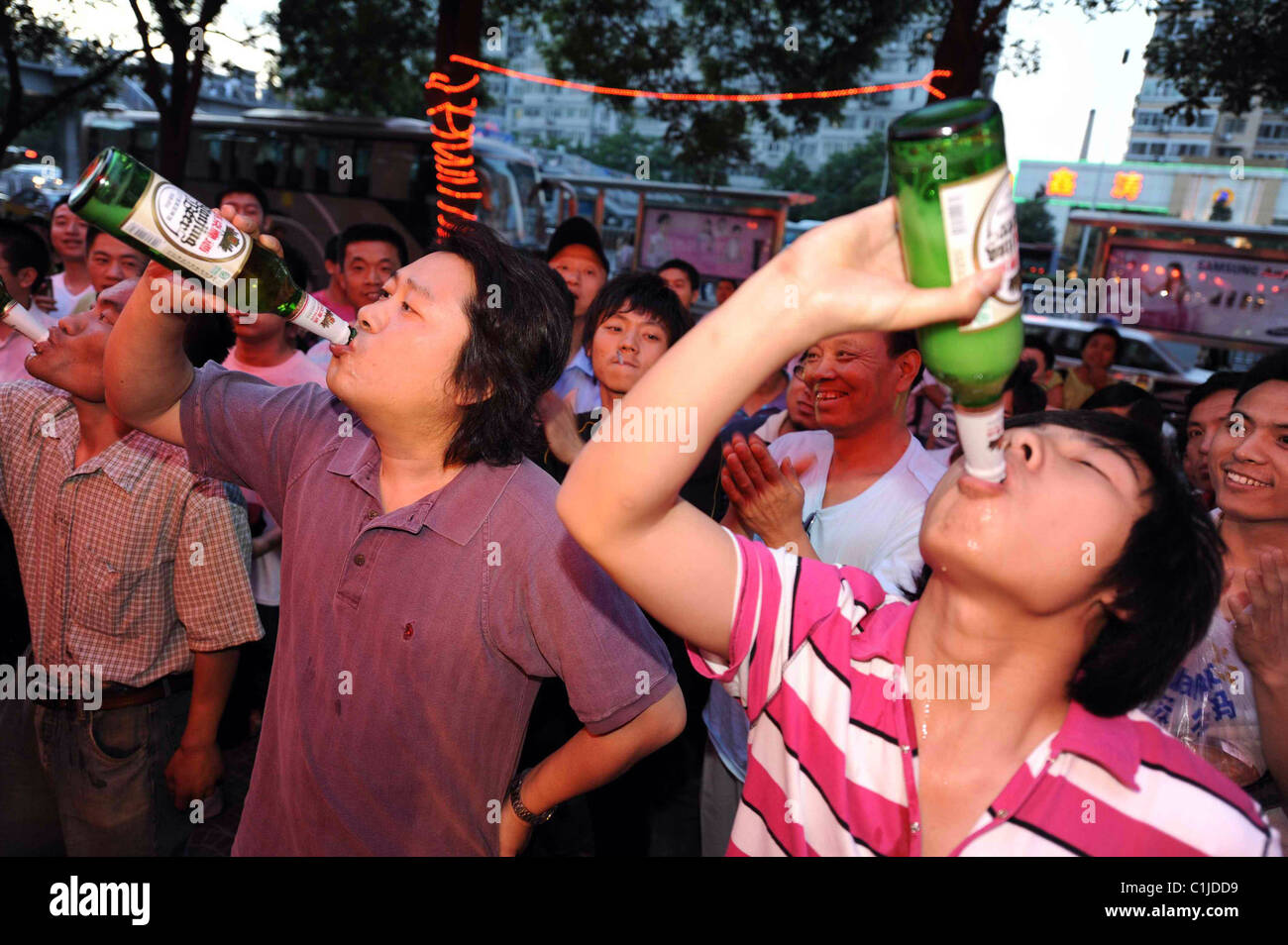 Speed drinking Revellers in Beijing, China take part in a beer drinking ...