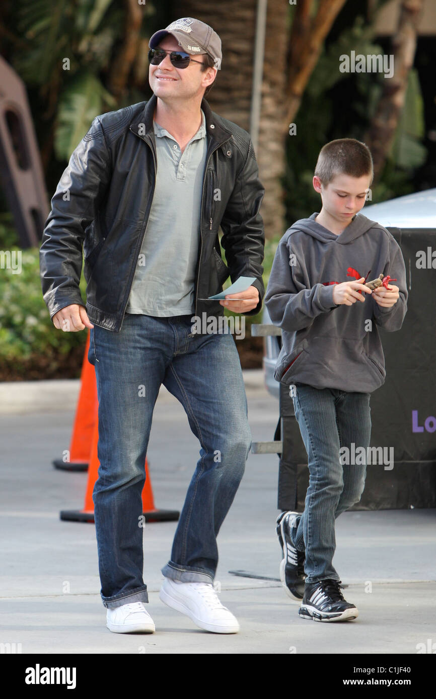 Christian Slater and his son Jaden, arrive for the first game of the ...
