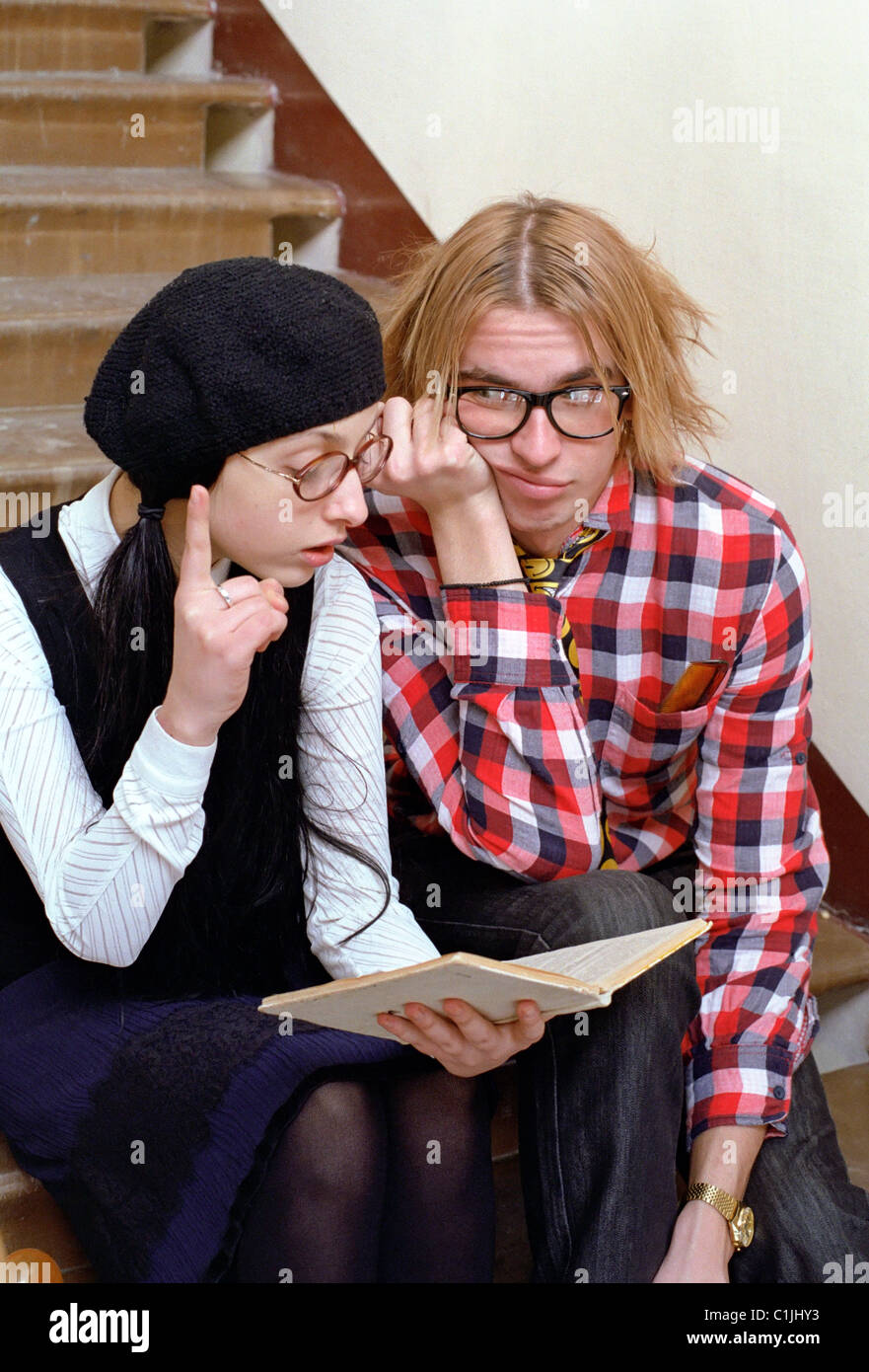 lazy and boring students read a book Stock Photo - Alamy