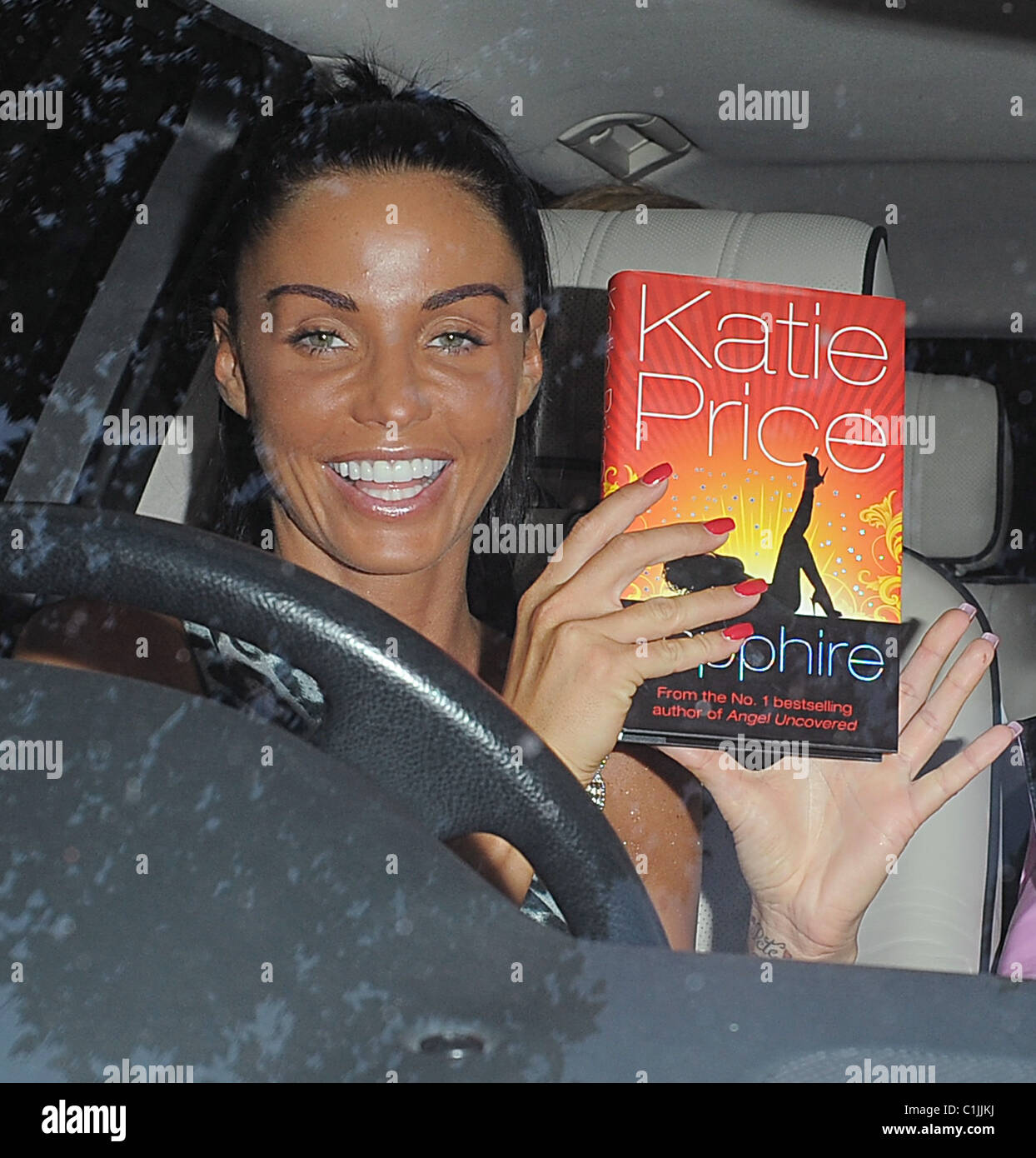 Katie Price aka Jordan leaving the Mayfair hotel via the back door ...