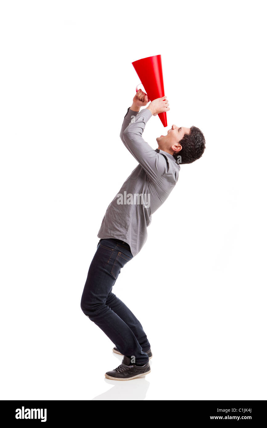 Young man shouting into a megaphone over a white background Stock Photo ...