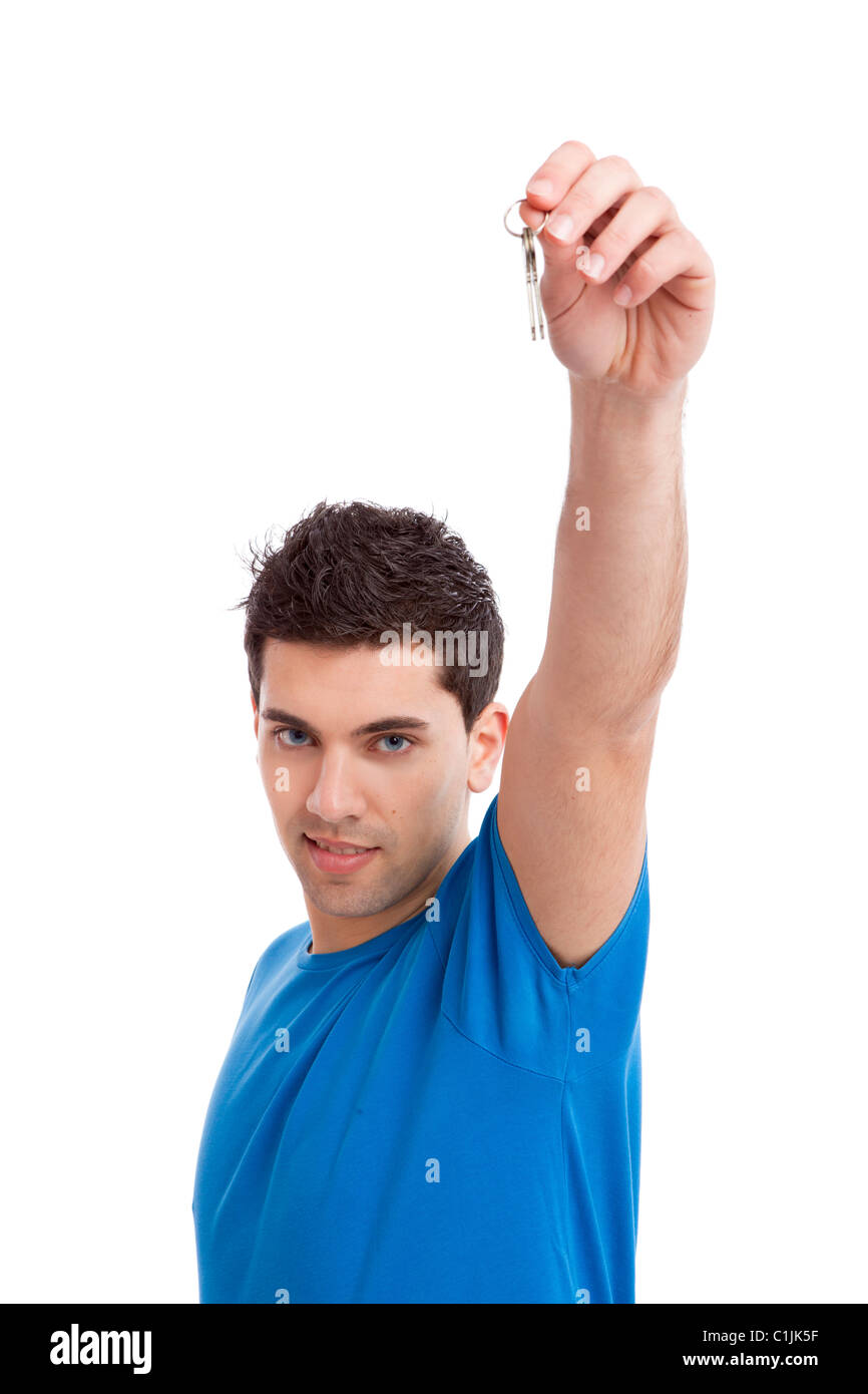 Portrait of a handsome young man holding the keys of your home Stock ...
