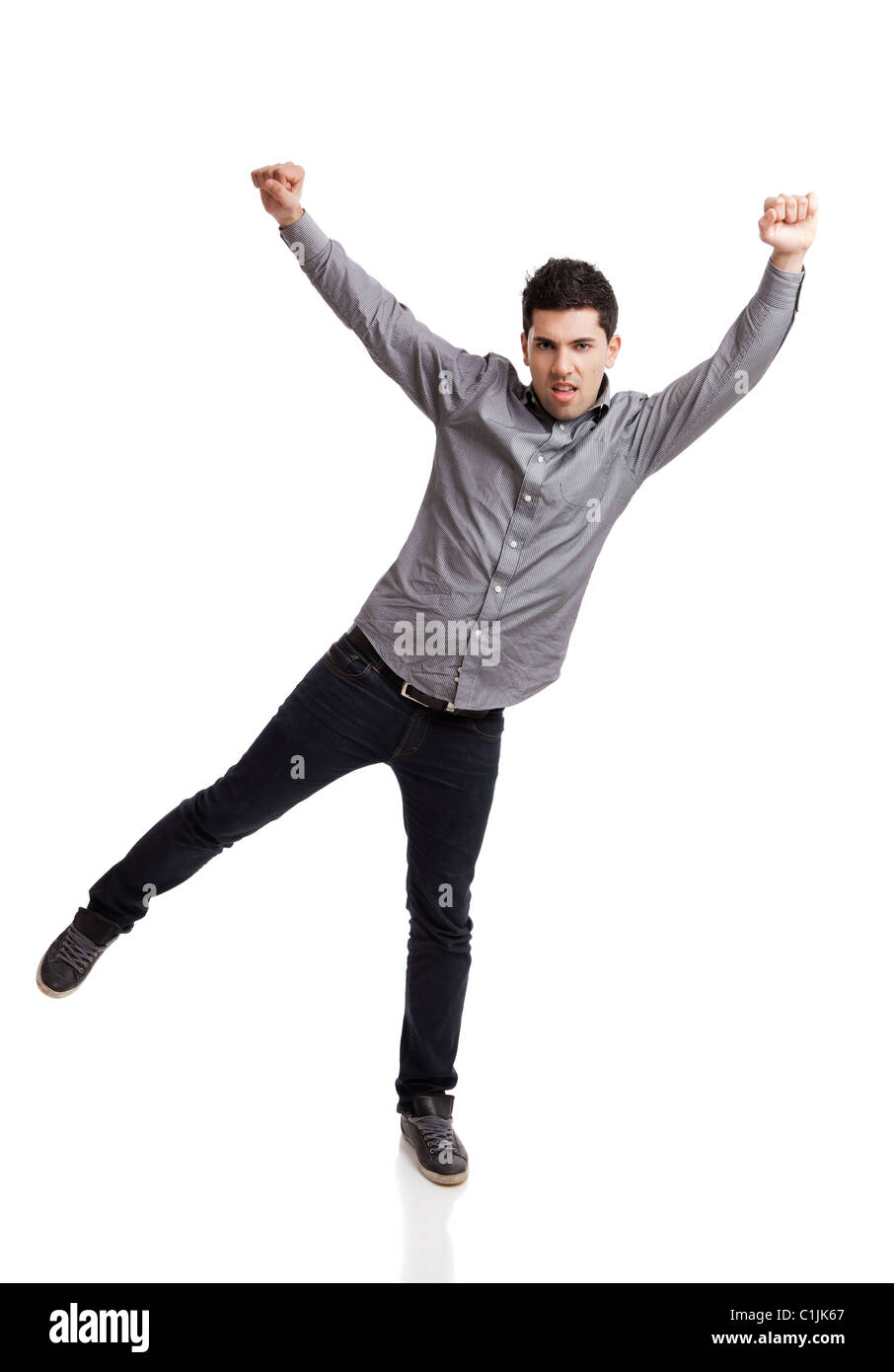 Happy young man with arms up isolated on a white background Stock Photo ...