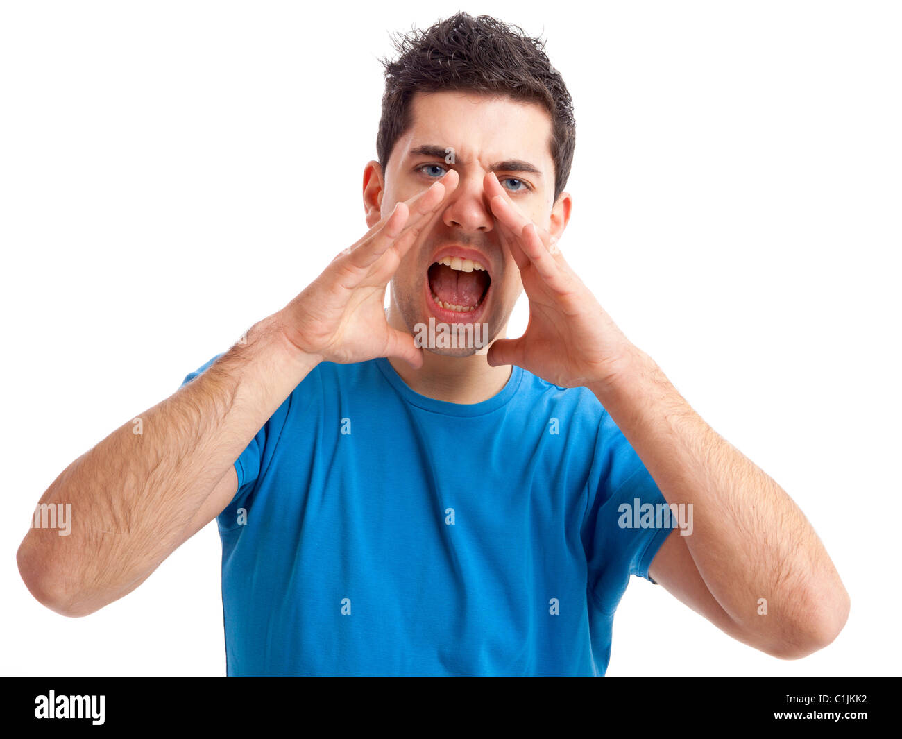 Portrait of a young man shouting loud with hands on the mouth, isolated ...