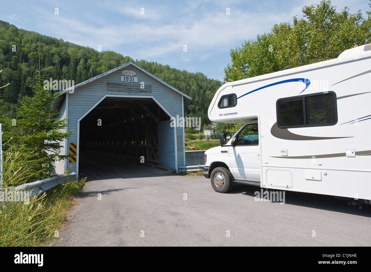 Quebec, Canada. Motorhome camper at De Routheirville covered bridge ...