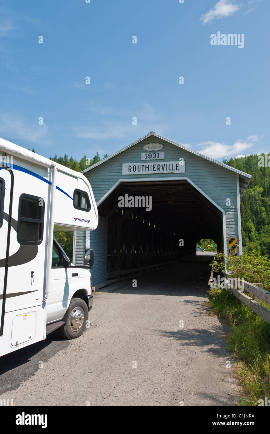 Quebec, Canada. De Routheirville covered bridge over the Matapédia ...