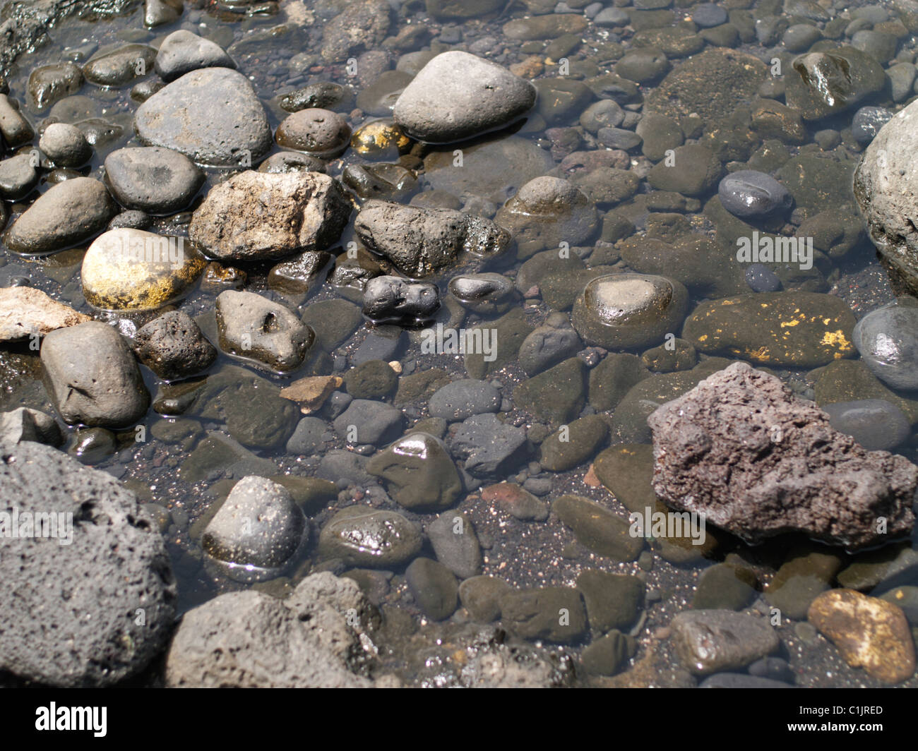 Stones in the sea Stock Photo - Alamy