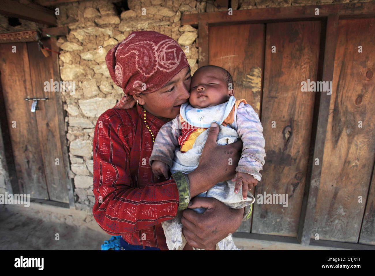 Nepali mother with child Stock Photo - Alamy