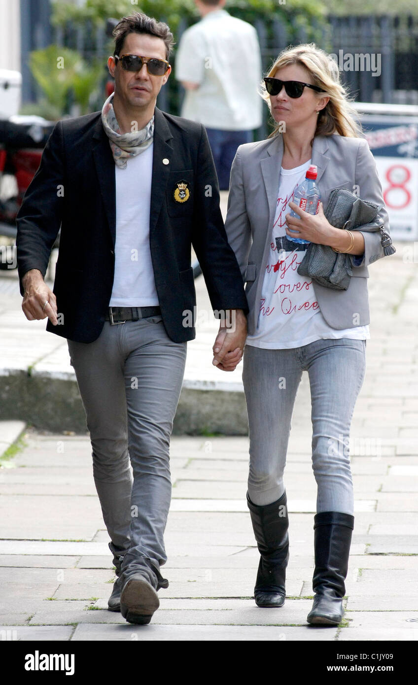Kate Moss and Jamie Hince looking very much in love as they hold hands ...