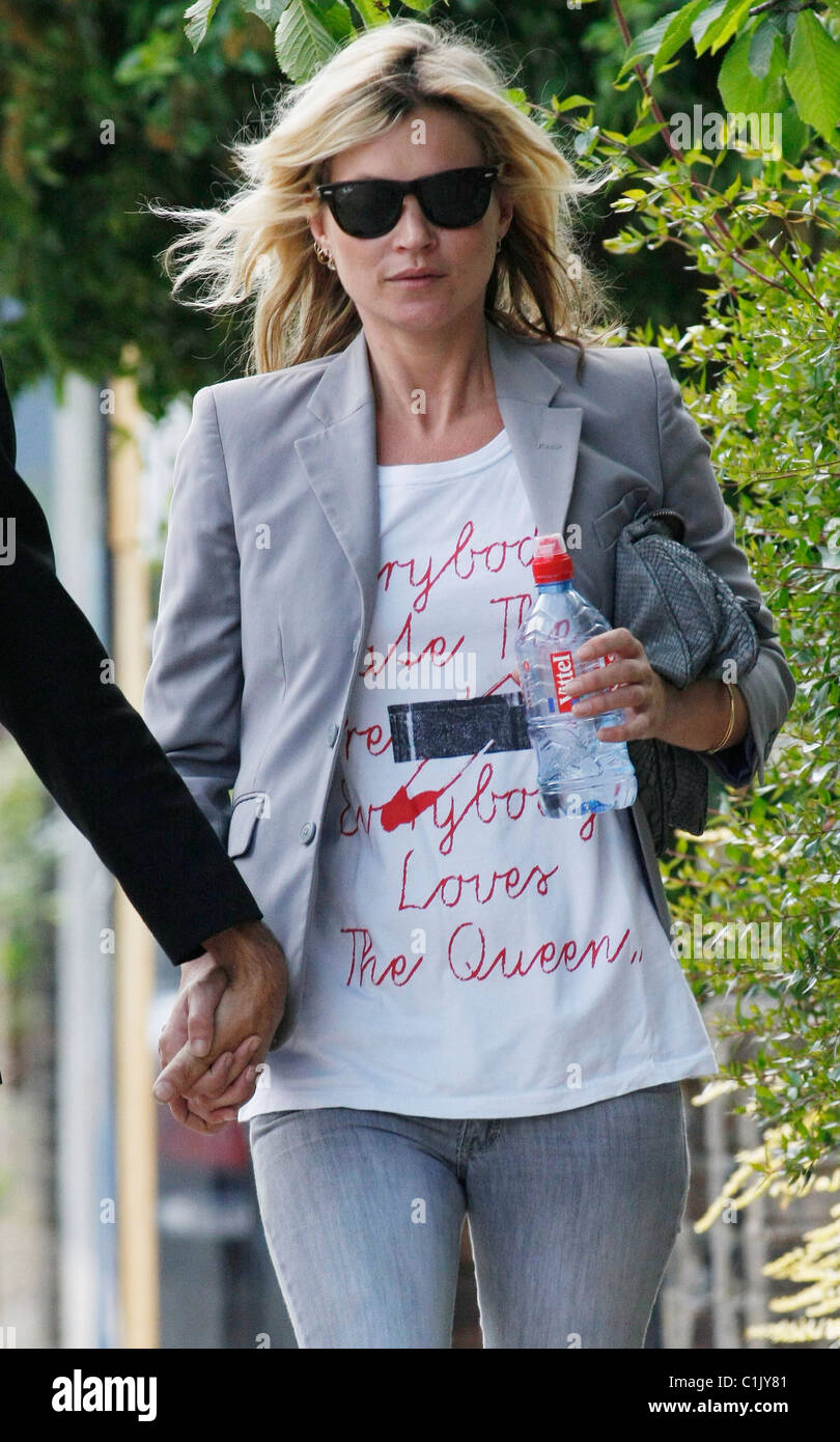 Kate Moss and Jamie Hince looking very much in love as they hold hands ...