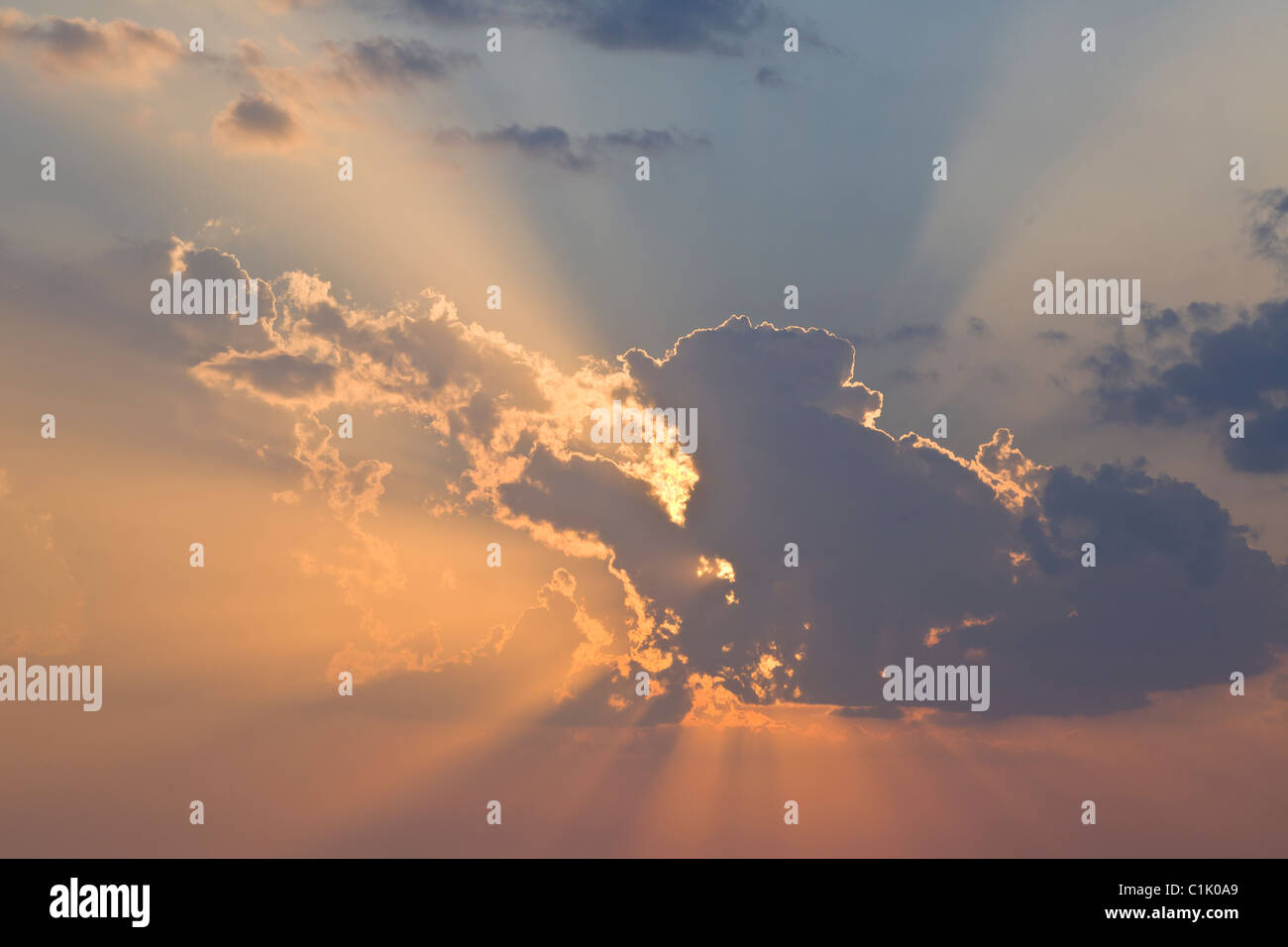 Orange sunset sky with god rays Stock Photo - Alamy
