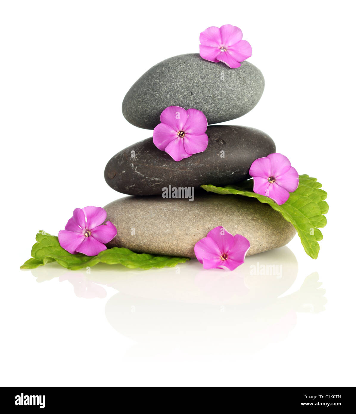 Stacked stones with flowers Stock Photo - Alamy