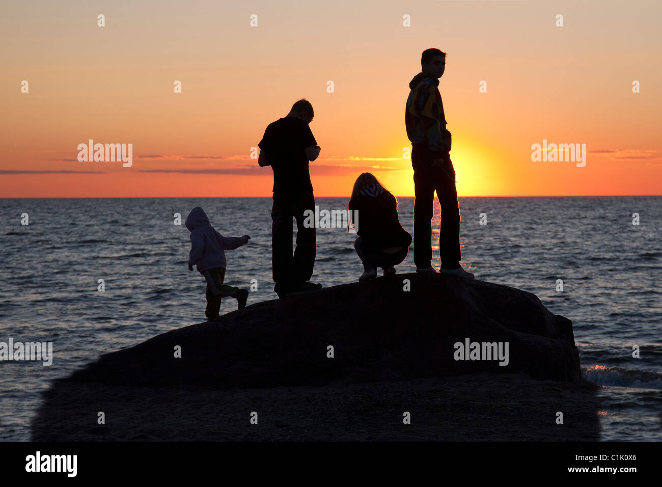 Kid Standing, Silhouette at Sunset Stock Photo - Alamy