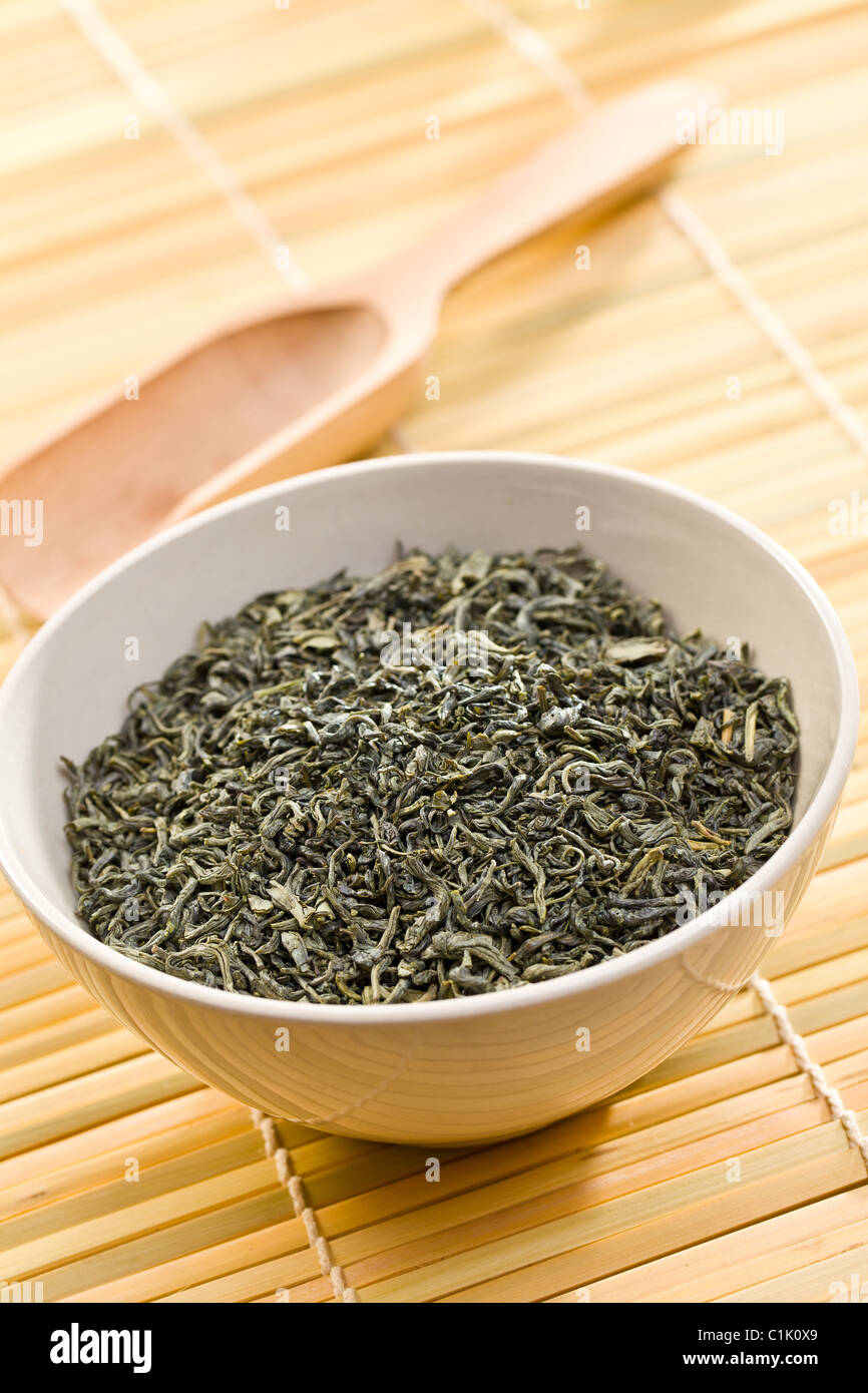 green tea leaves on kitchen table Stock Photo - Alamy