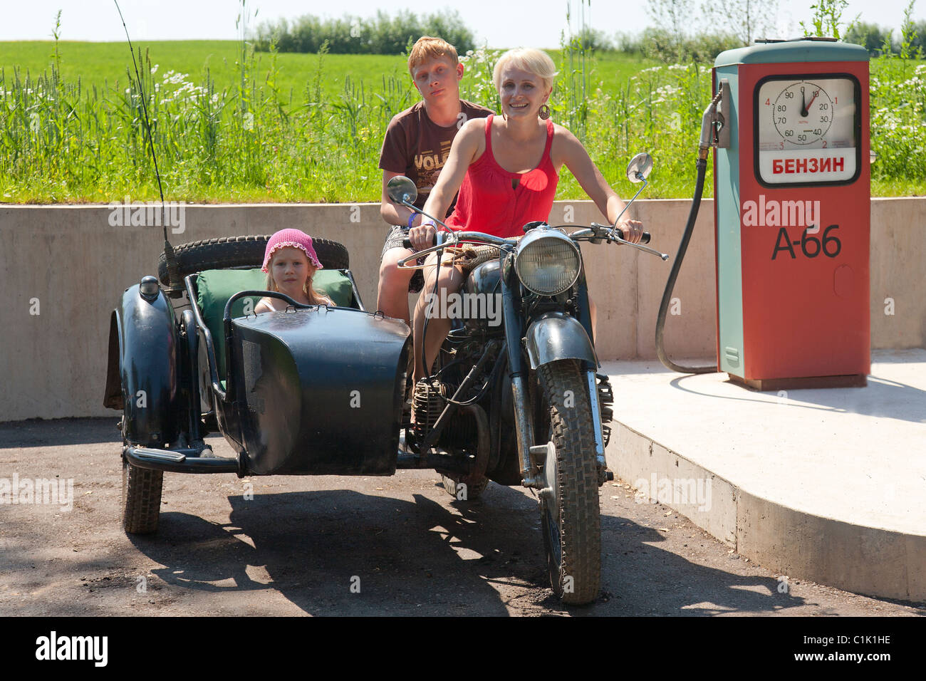 Family in Old Sidecar Motorcycle in Gas Station, Estonian Road Museum ...