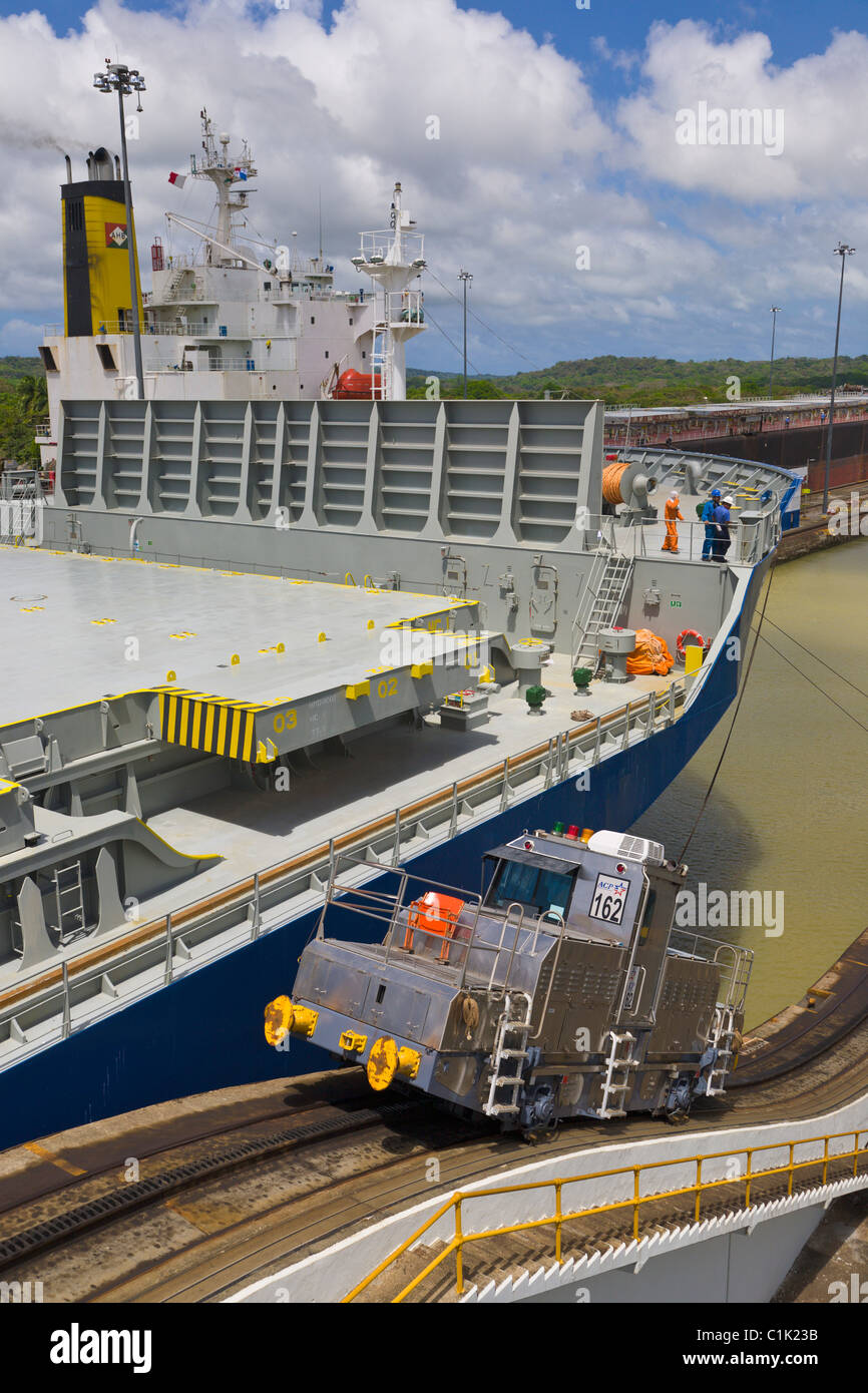 Mule and Norwegian cargo ship passing through Gatun Locks, Panama Canal ...